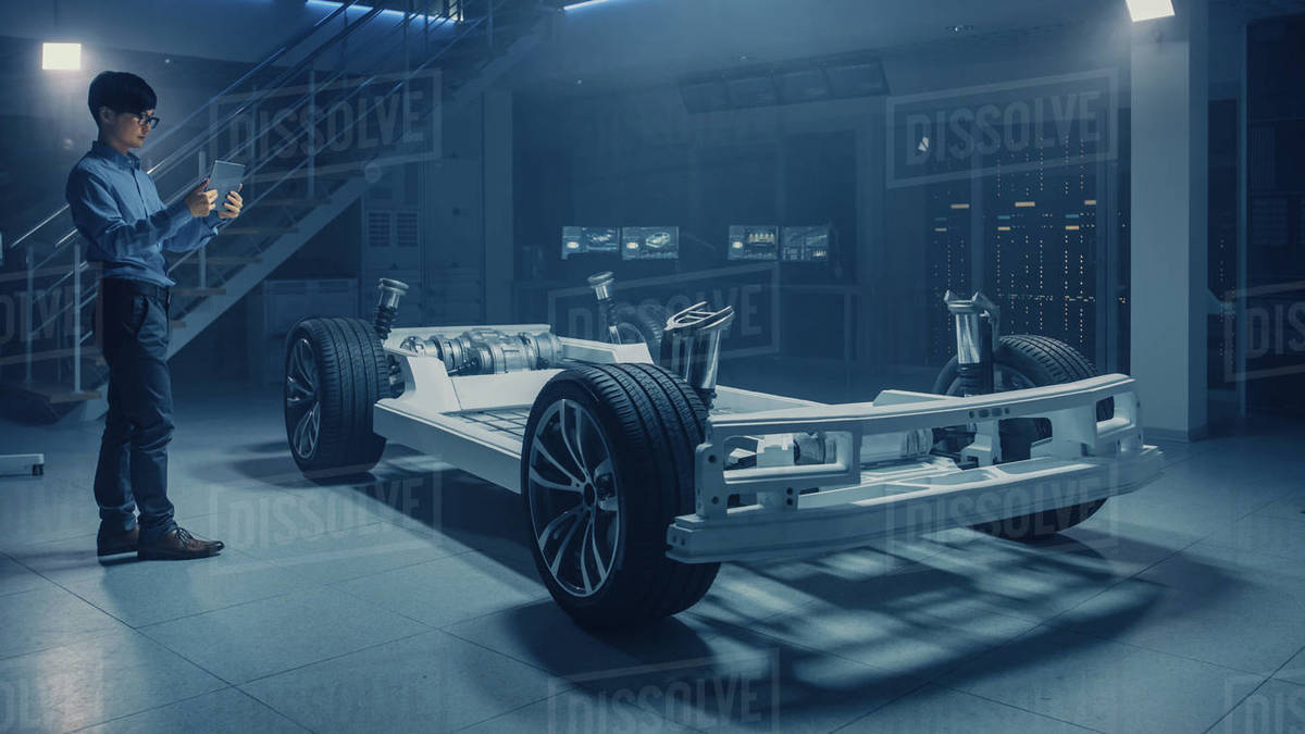 Automobile Engineer Working on Electric Car Chassis Platform, Using ...