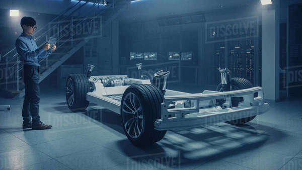 Automobile Engineer Working on Electric Car Chassis Platform, Using ...