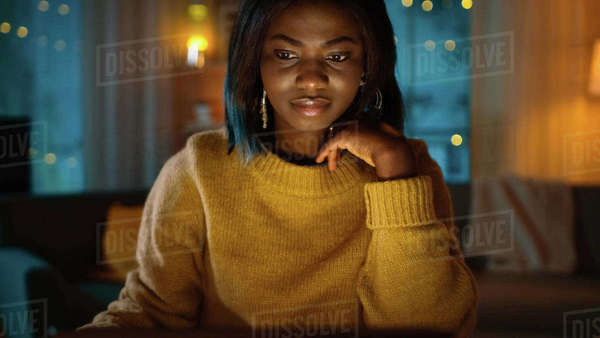 Portrait of Beautiful Black Girl Uses Computer while Sitting at Her ...