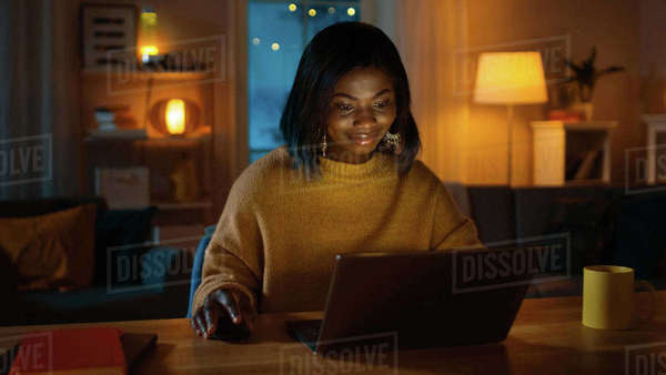 Portrait of Beautiful Smiling African American Girl Using Laptop while ...