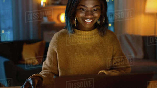 Portrait of Beautiful Smiling Black Girl Working on a Laptop while ...