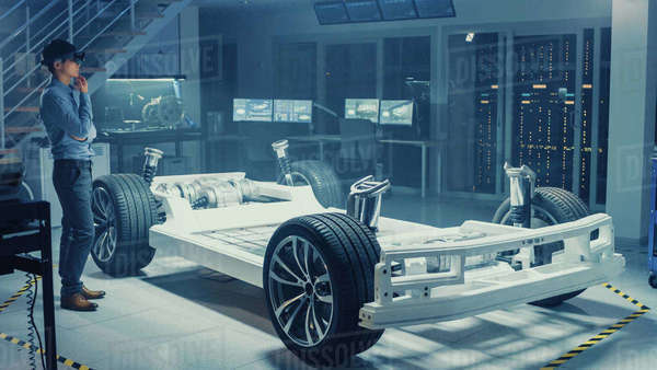 Automotive Engineer Working on Electric Car Chassis Platform, Using ...