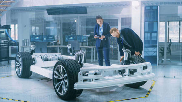 Automotive Design Engineers Working on Electric Car Chassis Prototype ...