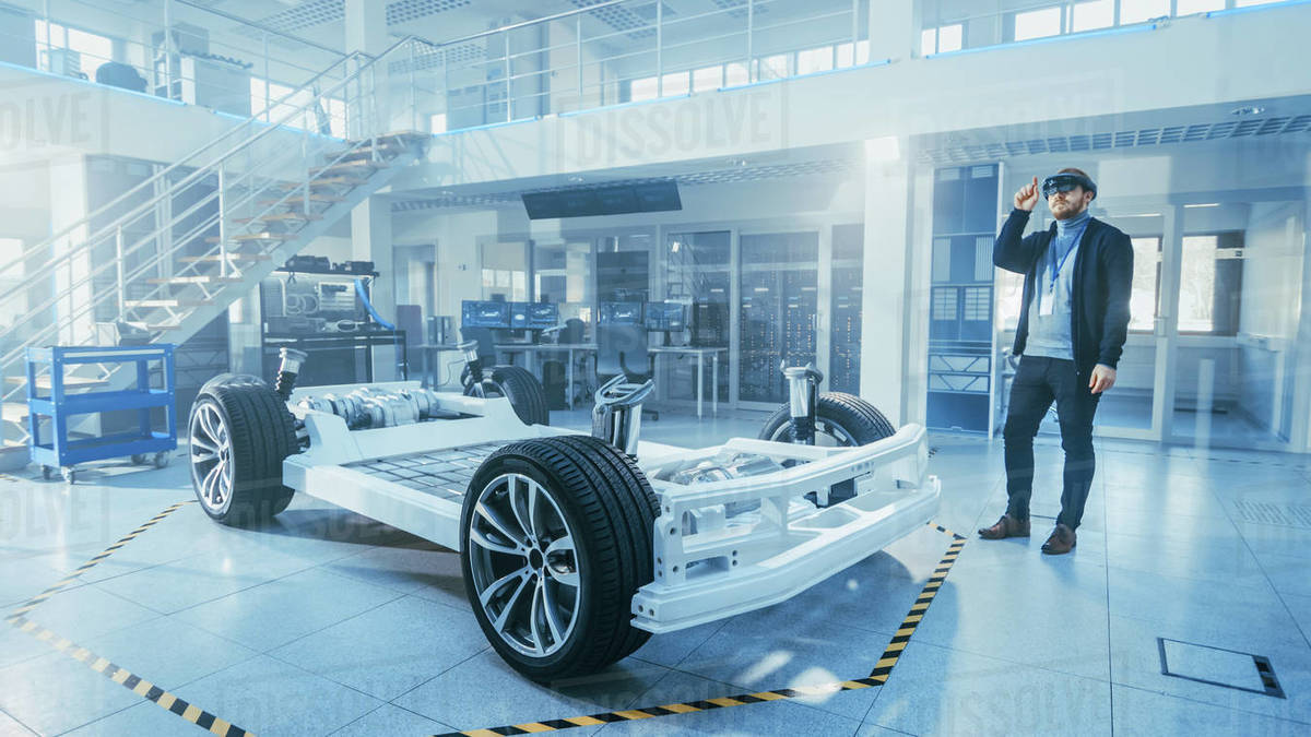 Automotive Engineer Working on Electric Car Chassis Platform, Using ...