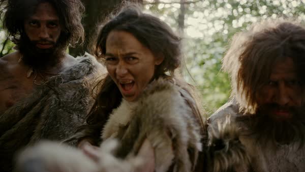 Female Leader and Two Primeval Cavemen Wearing Animal Skins Attack ...