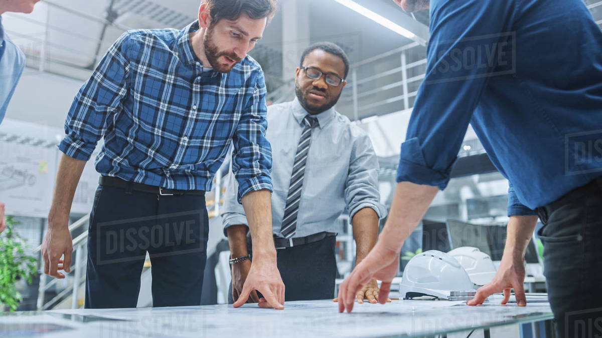 In the Industrial Engineering Facility: Diverse Group of Engineers and ...