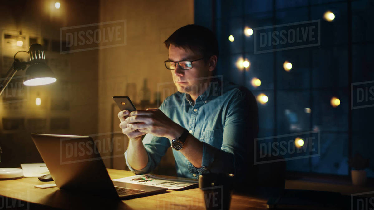 Professional Man Sitting at His Desk in Office Studio Working on a ...
