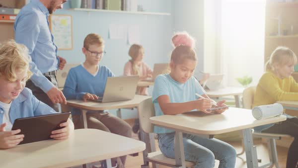 Elementary School Computer Science Class: Smart Girl Uses Digital ...