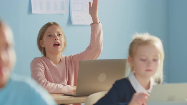 Elementary School Computer Science Class: Cute Girl Uses Digital Tablet ...