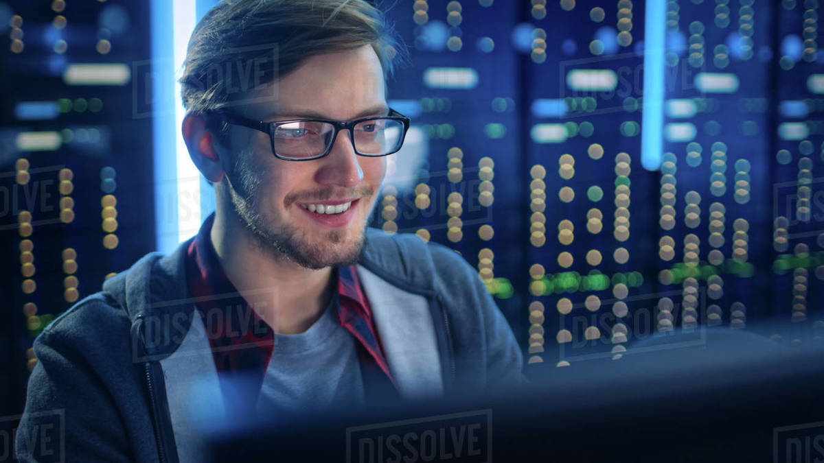 Portrait of Smart SmilingFocused Young Man Wearing Glasses Working on ...