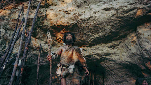 Primeval Caveman in Animal Skin and Fur Holds Stone Tipped Spear Comes ...