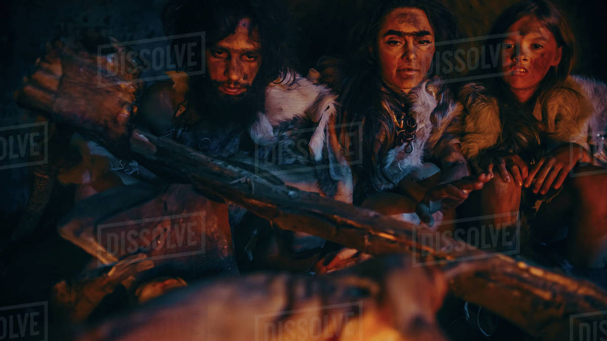 Neanderthal or Homo Sapiens Family Cooking Animal Meat over Bonfire and ...