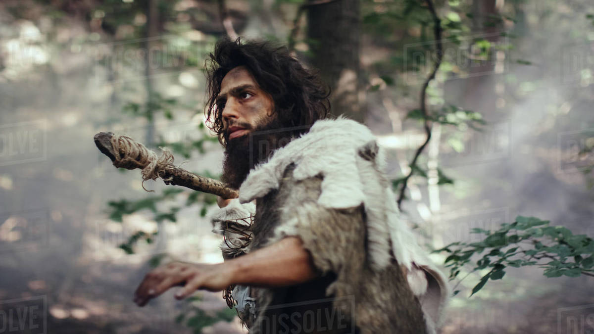 Primeval Caveman Wearing Animal Skin Holds Stone Tipped Spear Looks ...