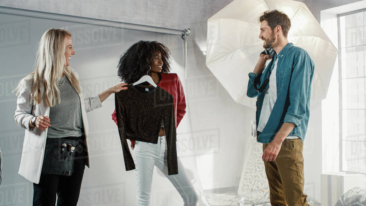 Backstage of the Photo Shoot: Stylist Chooses Outfit and Clothes for a ...