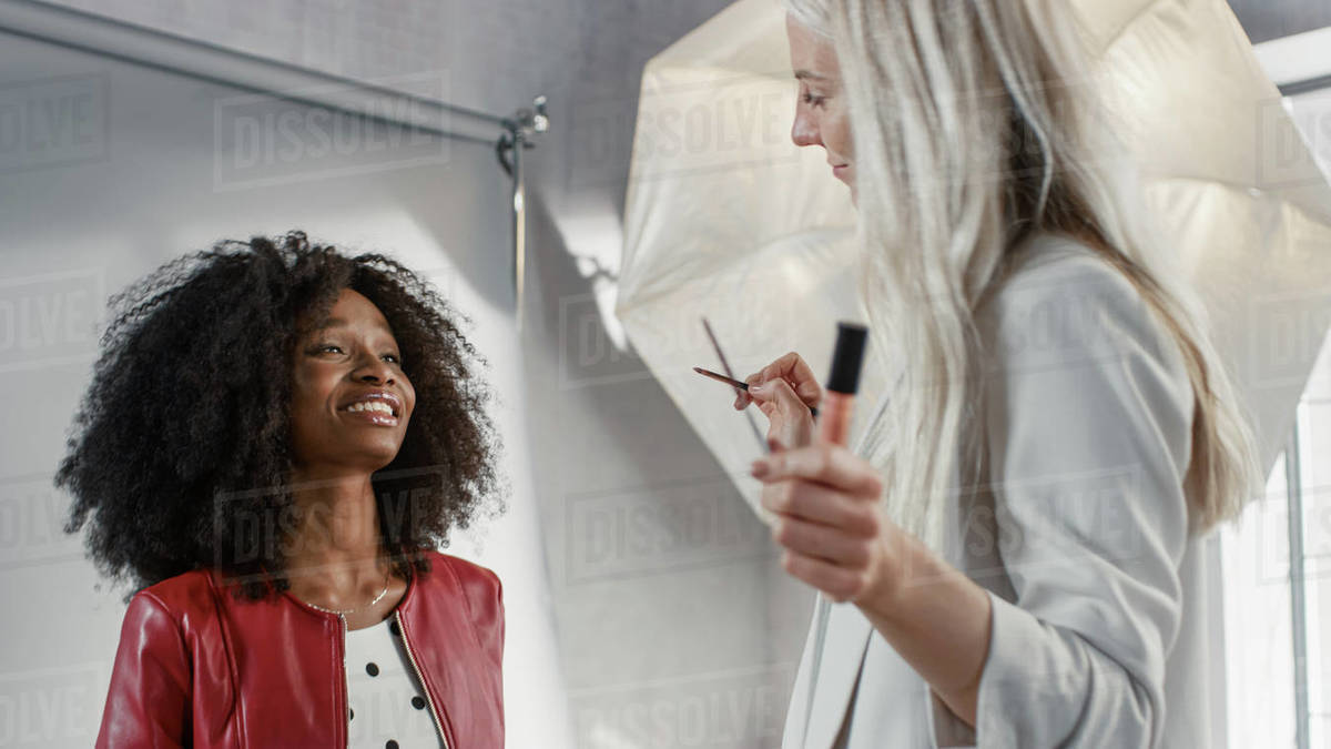 Backstage of the Photo Shoot: Make-up Artist Applies lipstick Makeup on ...