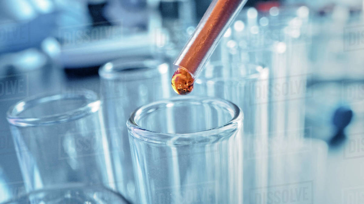 Pharmaceutics Laboratory: Pipette Dropping Red / Orange Liquid into ...