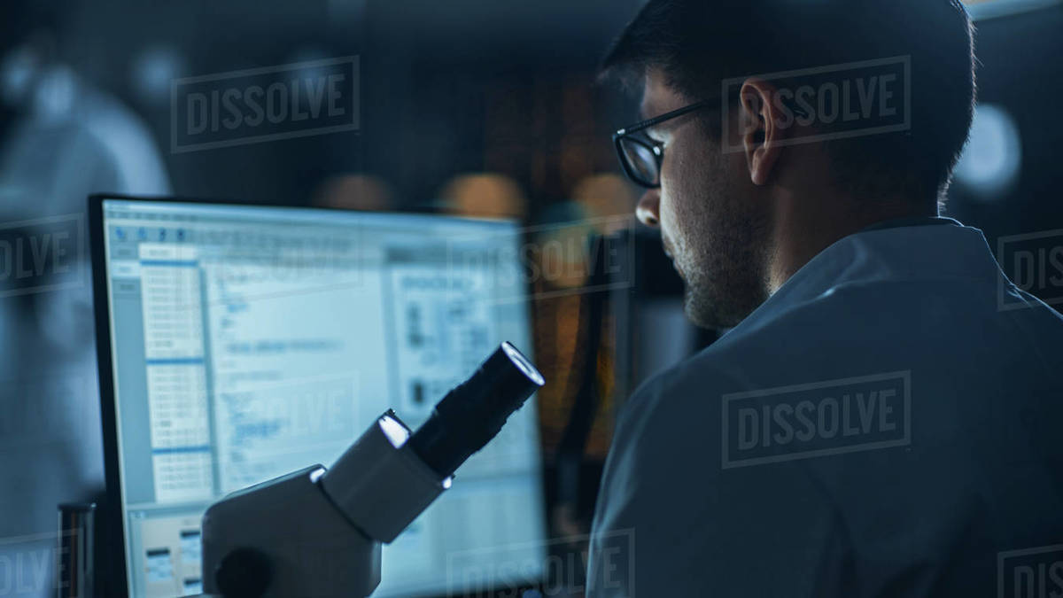 Shot of a Male IT Scientist Uses Computer Showing System Monitoring and ...