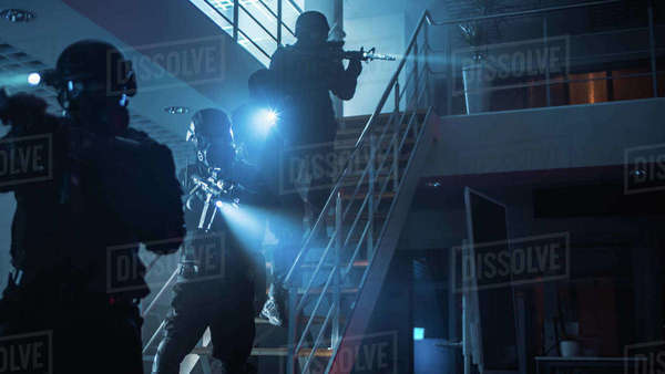 Masked Squad of Armed SWAT Police Officers Run Down the Stairs from a ...