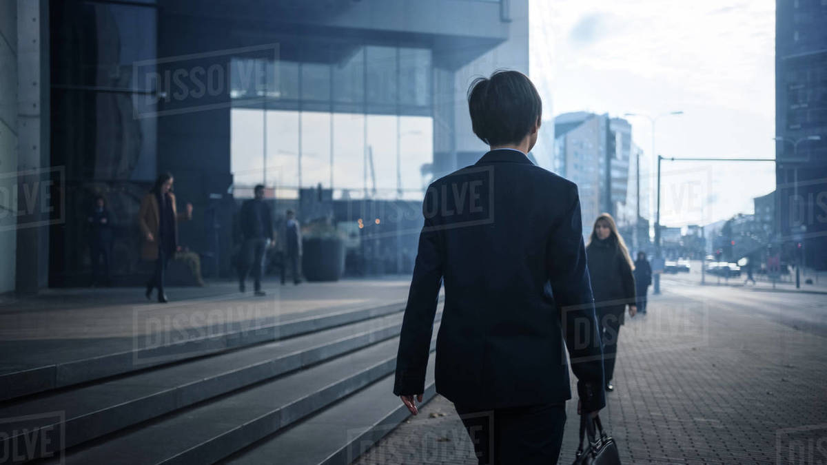 Businessman in a Suit Walking on the Street. Other Office People ...