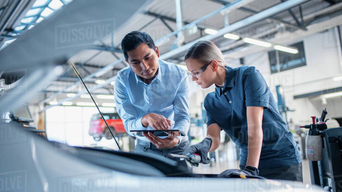 Instructor with a Tablet Computer is Giving a Task for a Future ...