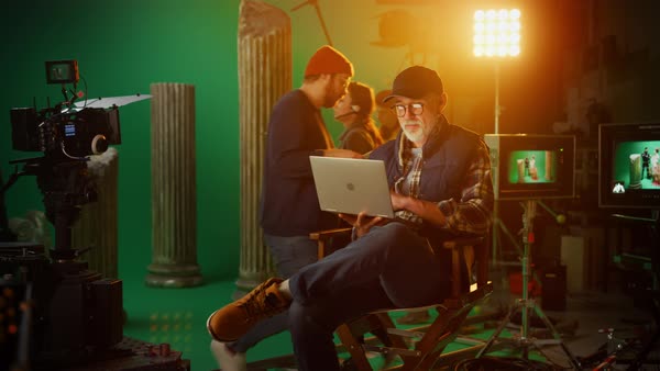 Prominent Successful Director Sitting in a Chair on a Break Using ...