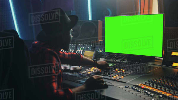 Portrait of Stylish Audio Engineer / Producer Working in Music Record ...