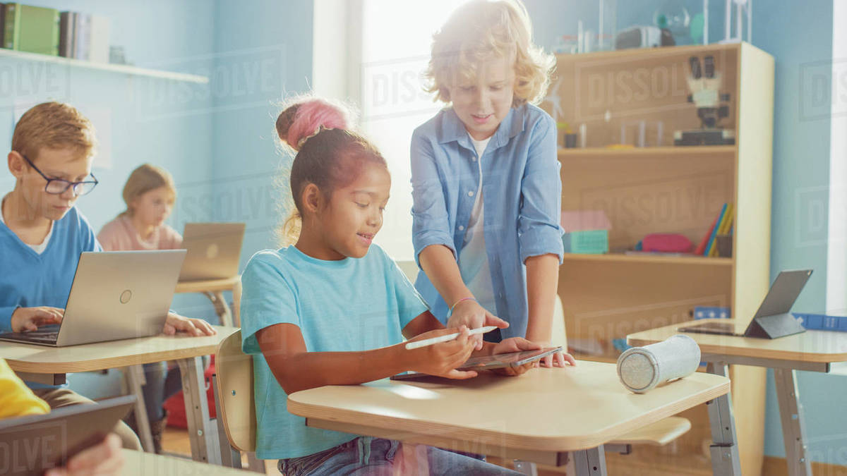 Elementary School Computer Science Class: Smart Girl Uses Digital ...