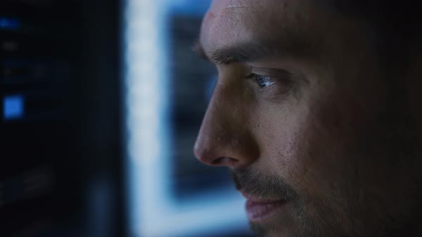 Confident Handsome Man Looks at Monitor Screen with Camera Moving to ...