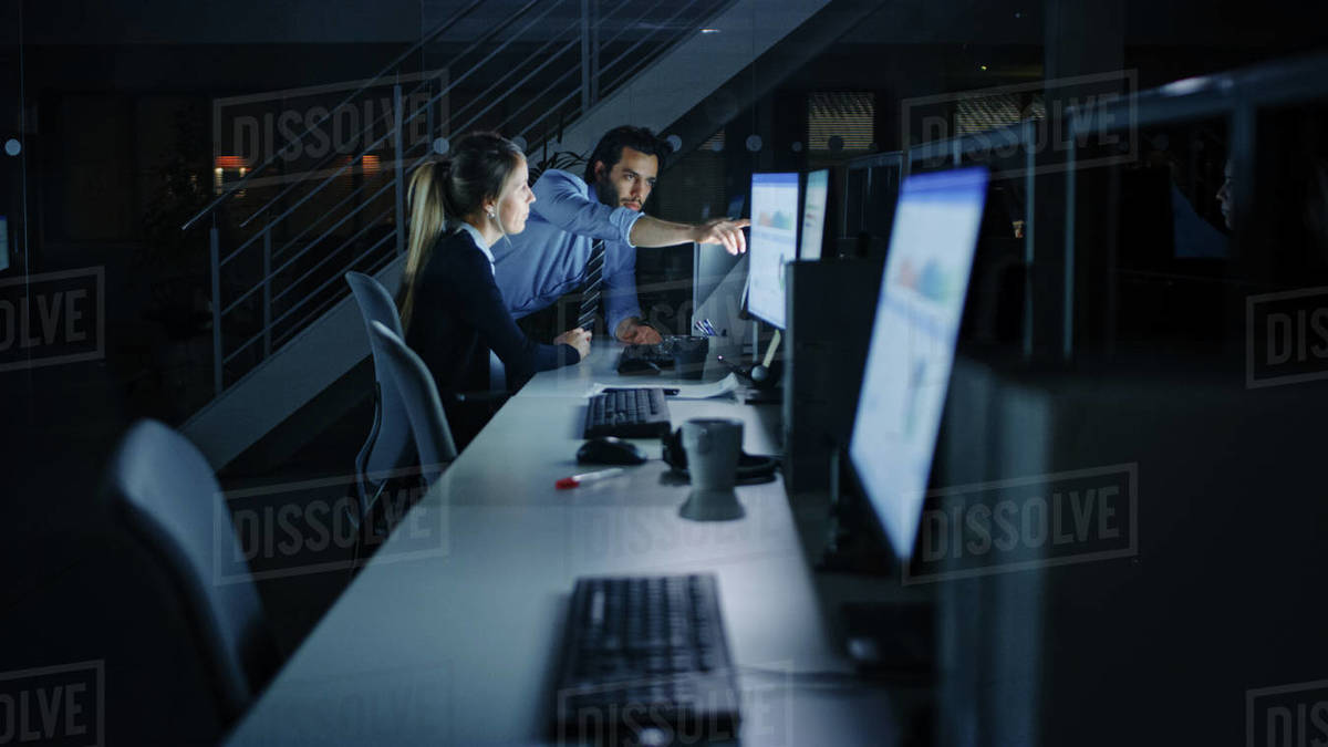 Confident Businessman Uses Desktop Computer, Her Male Manager Explains ...