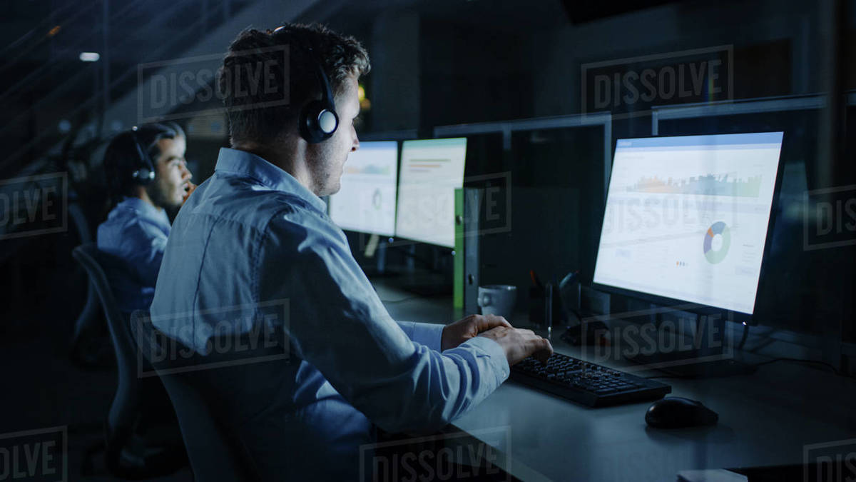 Late at Night In Modern Office: Row of Ambitious Businessmen and ...