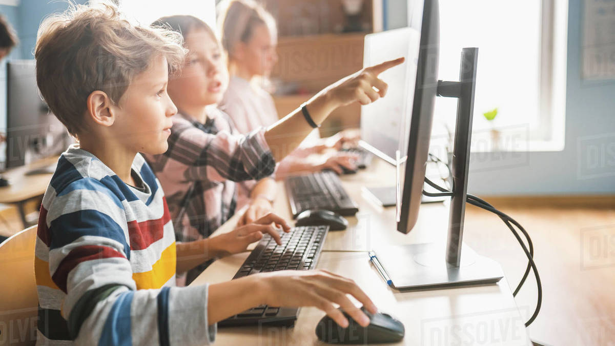 Elementary School Computer Science Classroom: Smart Girl Helps Boy ...