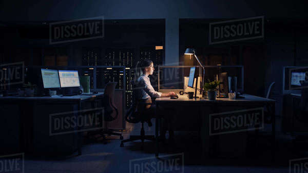 Working Late at Night in the Office: Businesswoman Uses Desktop ...
