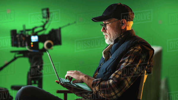 Prominent Successful Director Sitting in a Chair on a Break and Using ...