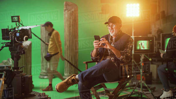 Prominent Successful Director Sitting in a Chair on a Break Using ...