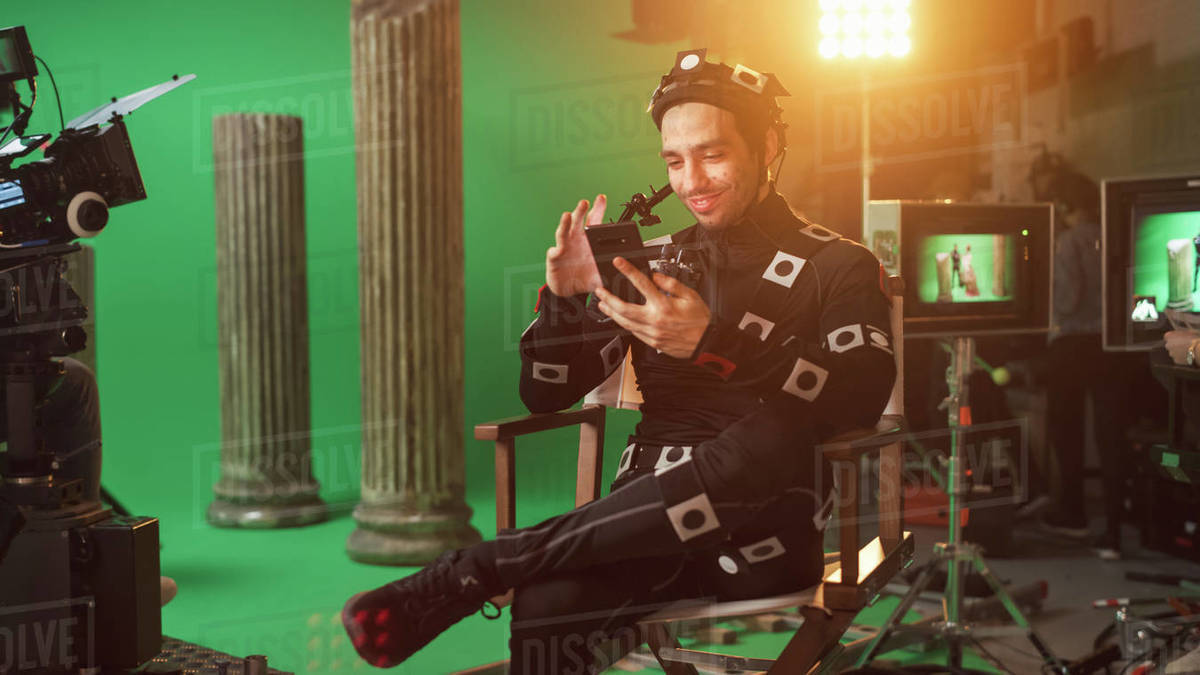 Handsome Smiling Actor Wearing Motion Capture Suit and Head Rig having ...