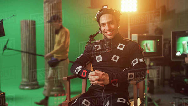Handsome Smiling Actor Wearing Motion Capture Suit and Head Rig having ...
