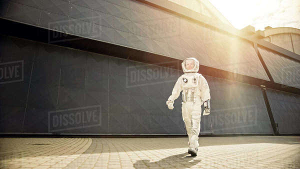 Low Angle Shot of a Confident Handsome Astronaut is Walking Towards ...