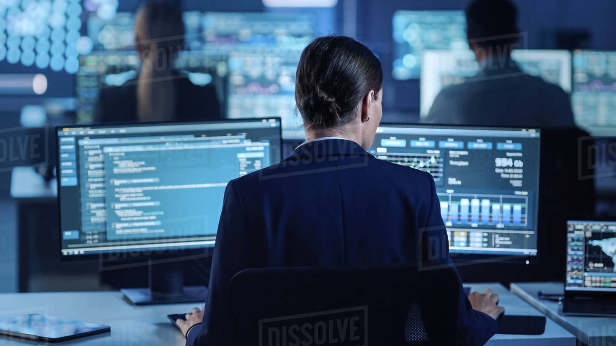 Confident Female Data Scientist Works on Personal Computer in Big ...