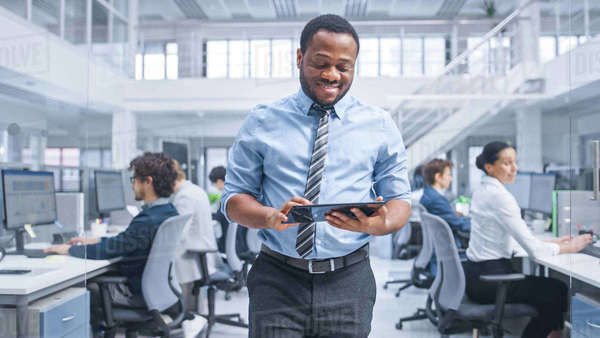 Handsome Young Black Manager in a Shirt Walking Pass His Business ...