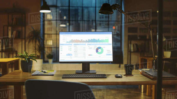 Shot of a Desktop Computer with Statistics Graph, Chart and Various ...