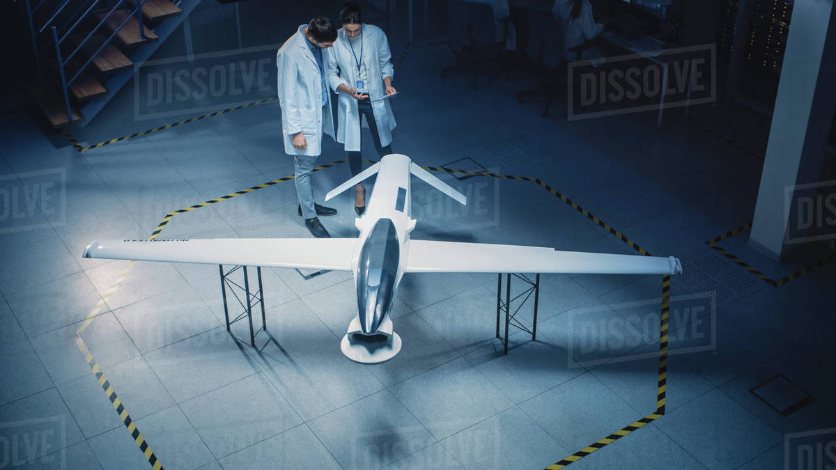 Two Aerospace Engineers Work On Unmanned Aerial Vehicle / Drone ...