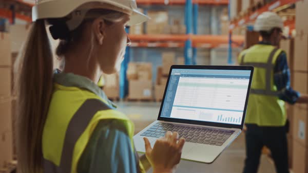 Professional Female Worker Wearing Hard Hat Holds Laptop Computer with ...