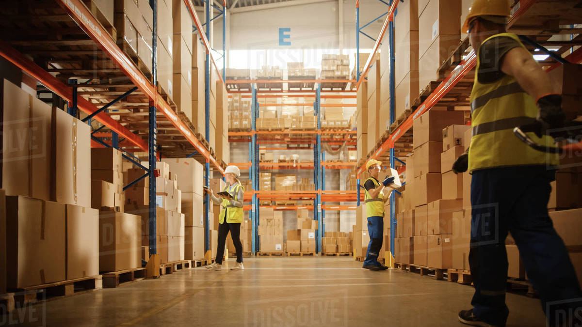 Retail Warehouse full of Shelves with Goods in Cardboard Boxes, Workers ...