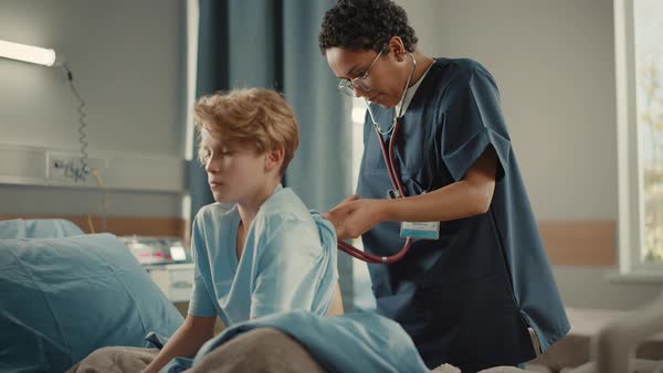 Hospital Ward: Handsome Young Boy Resting in Bed with Caring Mother ...