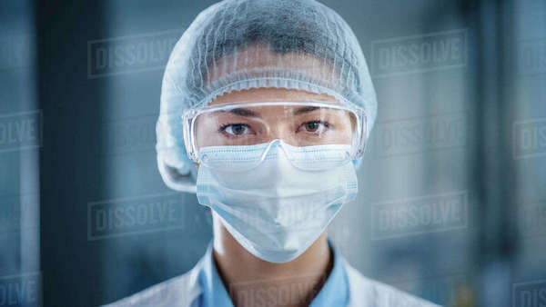 Close Up Portrait of a Female Doctor Wearing a Protective Face Mask ...