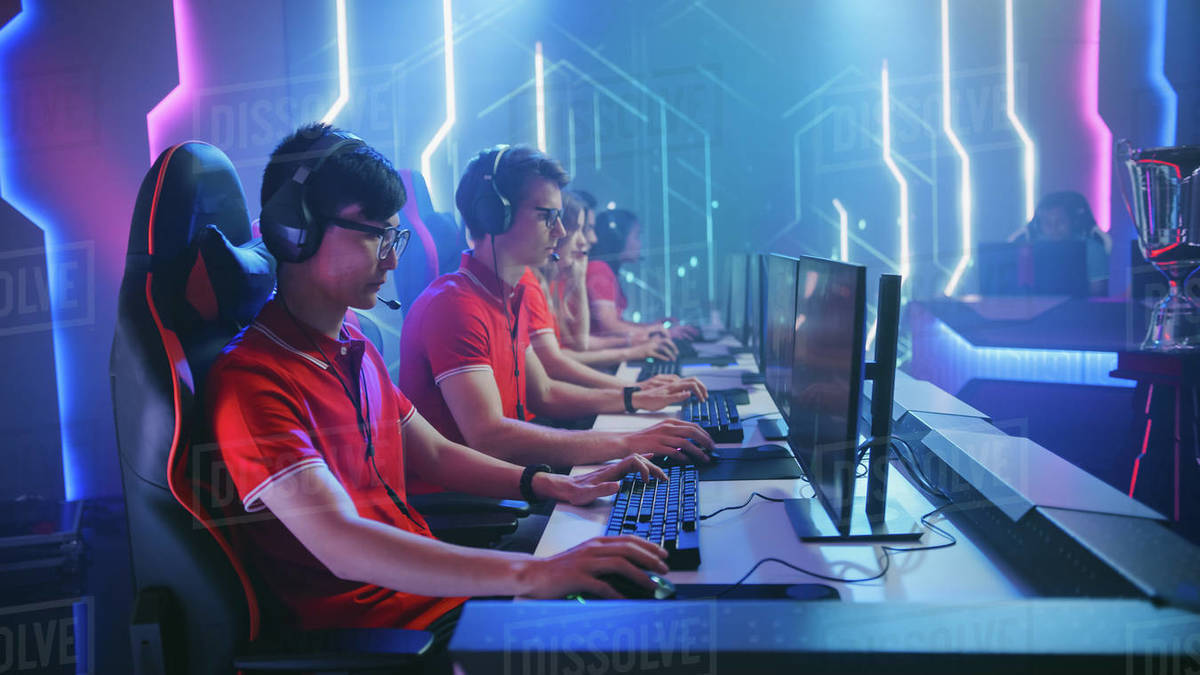 Shot of a Concentrated Esport Team of Pro Gamers Play in Video Game on ...