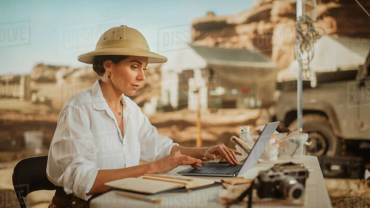 Female Archaeologist Doing Research - Royalty-free Stock Photo | Dissolve