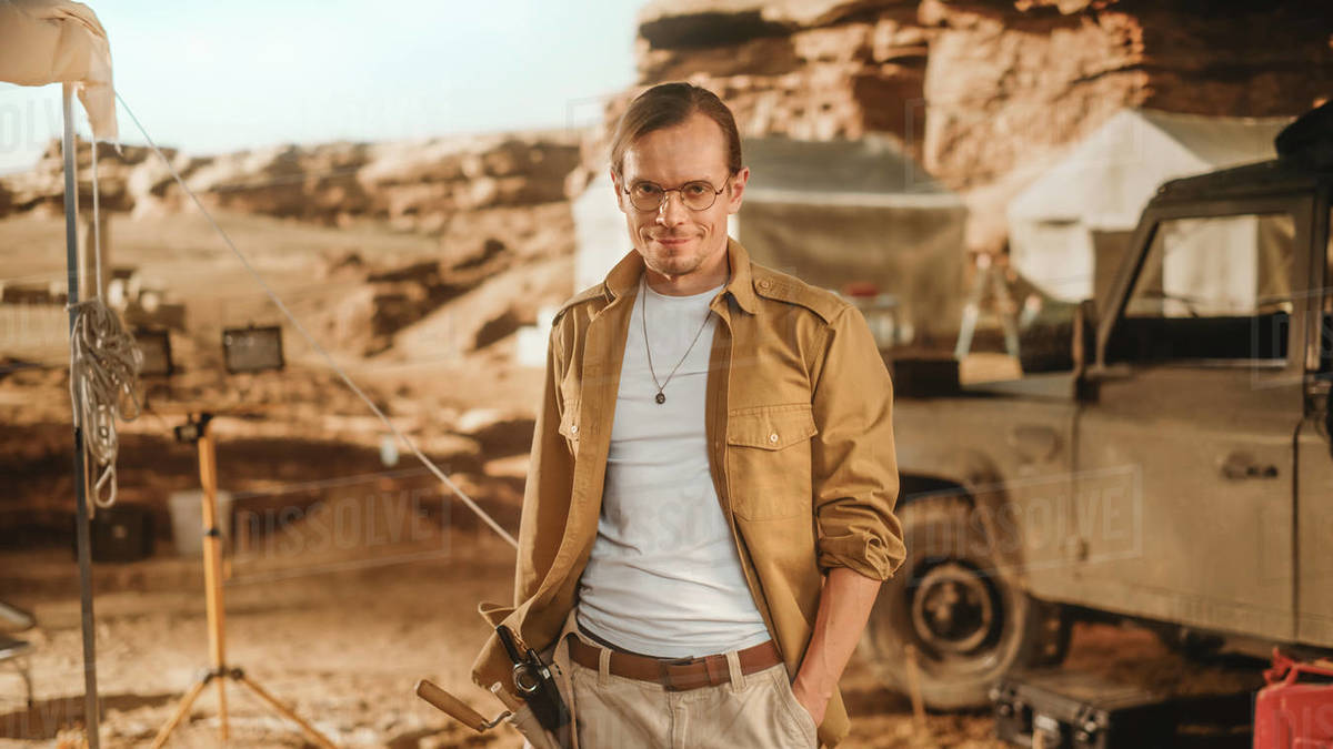 Male Adventurer Posing and Looking at Camera - Stock Photo - Dissolve