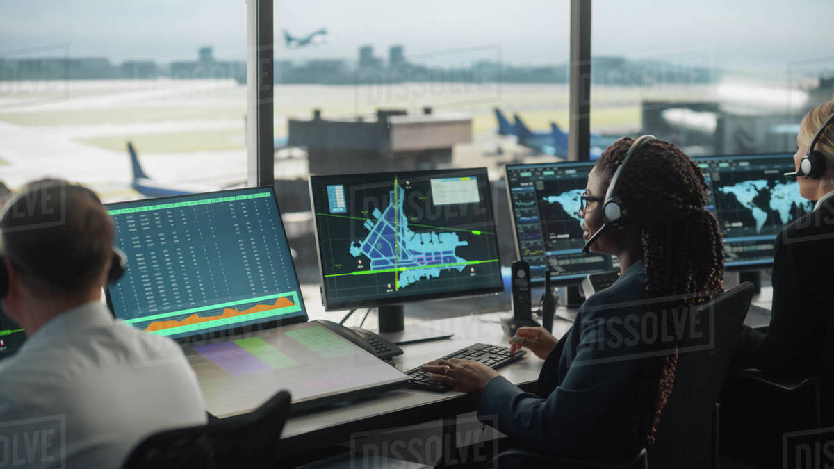 Diverse Air Traffic Control Team Working in a Modern Airport Tower ...