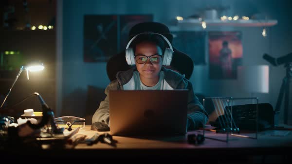 Young Teenage Multiethnic Girl Using Laptop Computer and Wearing ...